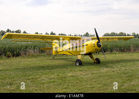 Flight training, small single engine plane ascends into a moody, stormy ...