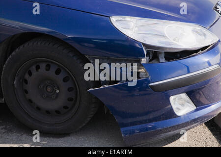 Road accident. Car with the front bumper ripped off following a ...