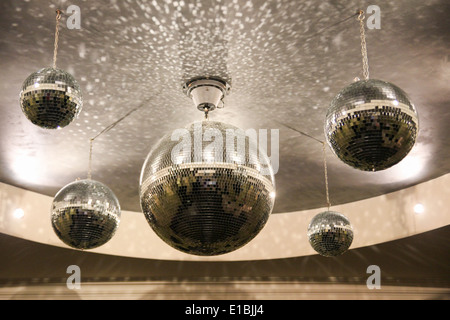 Shiny disco balls with rays on navy blue background. Festive party ...