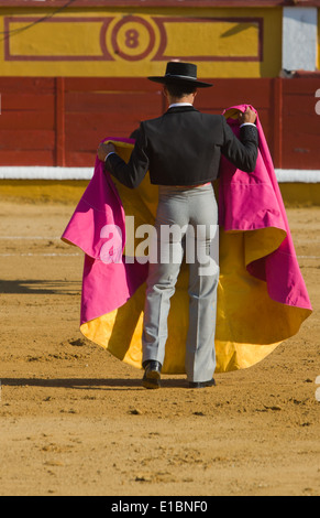 The bullfighter waits the bull with the capote during a bullfight in ...