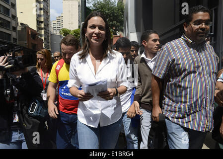 Venezuelan opposition leader María Corina Machado speaks with reporters ...