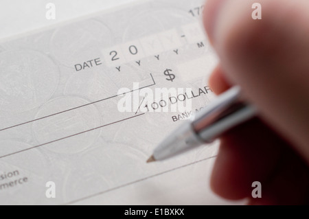 Business woman prepare writing a check Stock Photo - Alamy