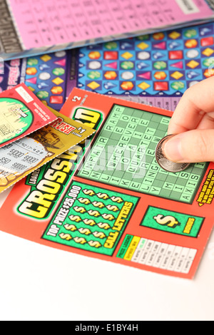 Scratching lottery tickets Stock Photo - Alamy