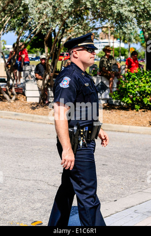 Male police officer in uniform poses in the car. Policeman protect the ...