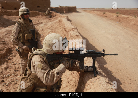 U.S. Marine Corps Sgt. Chad J. Twenter, right, with the Musa Qa'leh ...