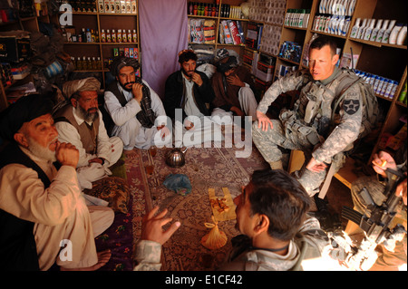 U.S. Army Lt. Col. Burton Shields and his translator, meet with village ...