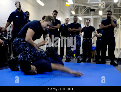 US Navy Master-at-Arms 1st Class stands with her recent class of Drug ...