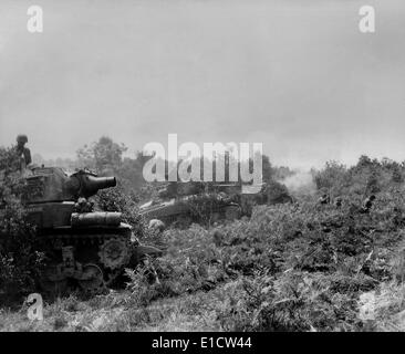 U.S. tanks in combat in the hedgerows of Normandy, during the Battle of ...