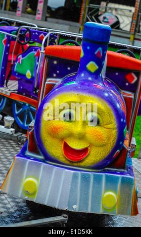 Toy train face fun fair ride Stock Photo - Alamy