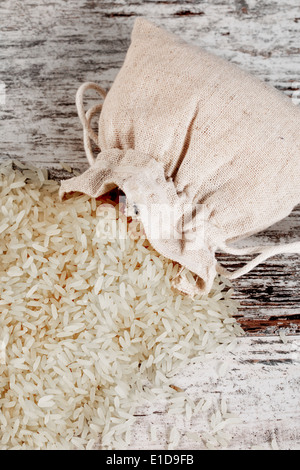 burlap sack full of rice Stock Photo - Alamy