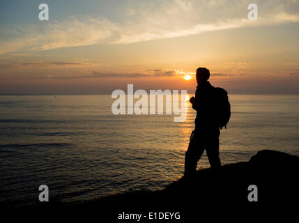 Walker at Nose`s Point near Seaham at sunrise on the Durham Heritage ...