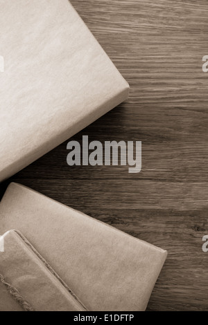 parcel wrapped packaged box on wooden background Stock Photo - Alamy