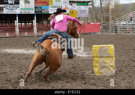 Teenage high school girl competes in barrel racing Stock Photo - Alamy
