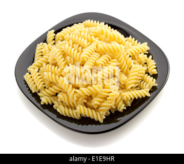 pasta fusilli in plate isolated on white background Stock Photo - Alamy