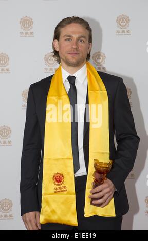 Actor Charlie Hunnam poses in the press room with the Best Global ...