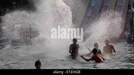 Lahore, Pakistan. 01st June, 2014. Pakistani youngster jumping and ...