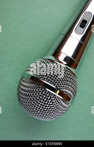 Classic dynamic microphone on a green background Stock Photo - Alamy
