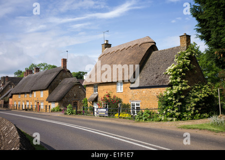 Thatched roof houses in an Iron Age village in The Land of Legends in ...