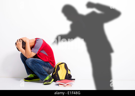 Man shadow attack to terrified student with a fist Stock Photo - Alamy
