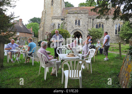 Cream teas being served in Pluckley St Nicholas Churchyard Kent UK ...