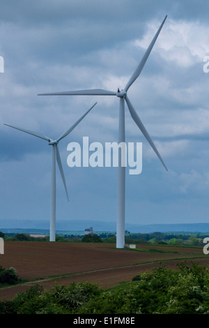France. Wind turbines tower over building and farms Stock Photo - Alamy