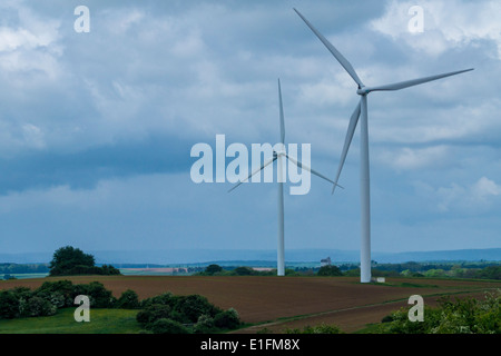 France. Wind turbines tower over building and farms Stock Photo - Alamy