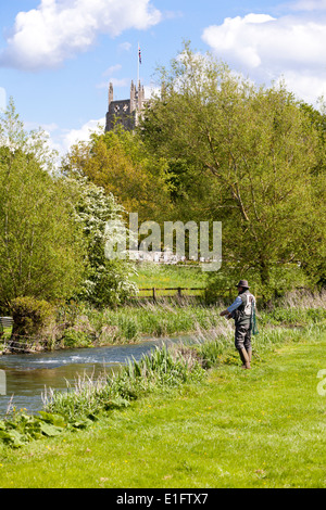 A man fishing in the River Coln in Fairford, Gloucestershire, UK Stock ...