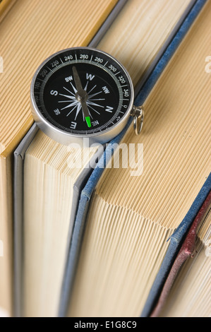 compass and the old books Stock Photo - Alamy