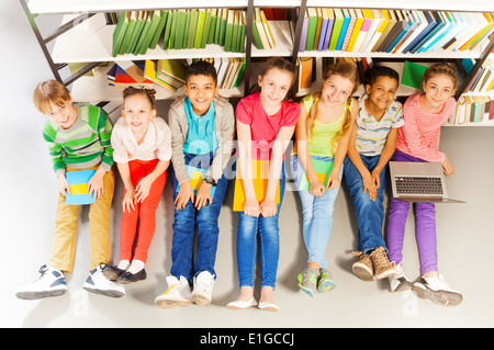 Seven kids are on the floor together. Top view . Happy smiling children ...