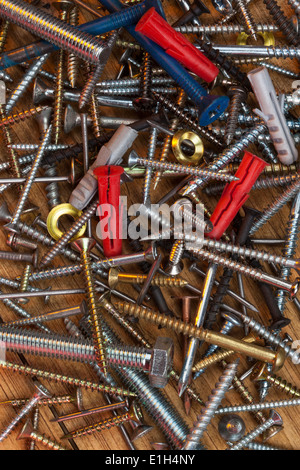 Screws and nails on wooden background. Set of various screws. Repair ...