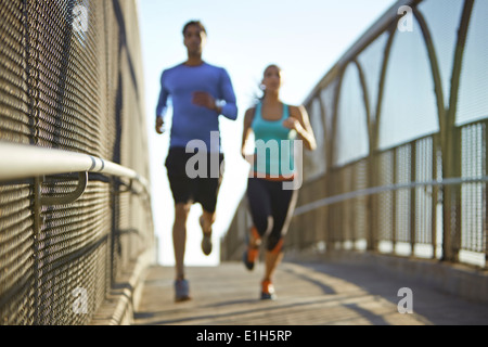 Man and woman jogging over a bridge in Parco di Monza Stock Photo - Alamy