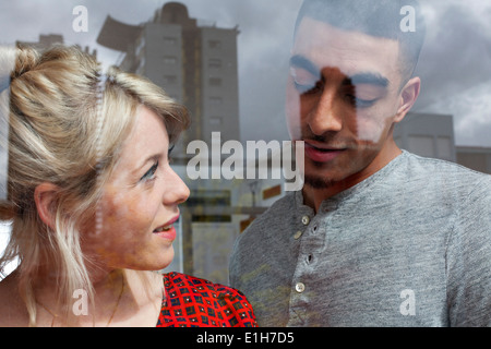Young couple through window Stock Photo - Alamy