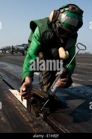 US Navy (USN) AIRMAN (AN) John Sumter mans conflagration station two ...