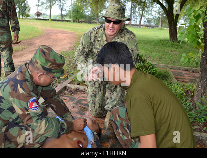 U.S. Navy Hospital Corpsman Master Chief Victor Alonzo, right, command ...