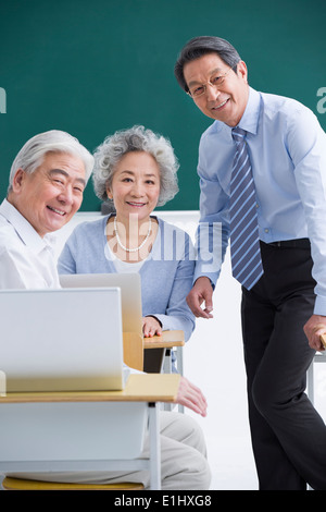 Senior adults having computer class at school Stock Photo - Alamy