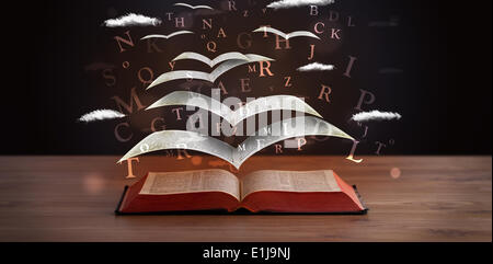 Open flying books in the sky with sunshine Stock Photo - Alamy