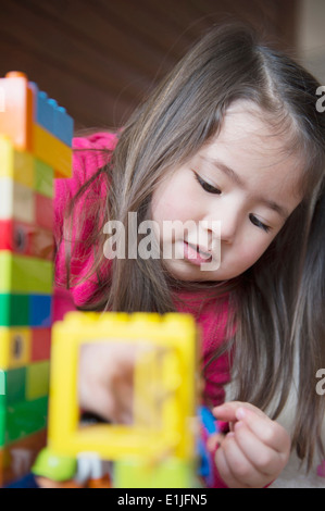Girl playing by herself Stock Photo - Alamy