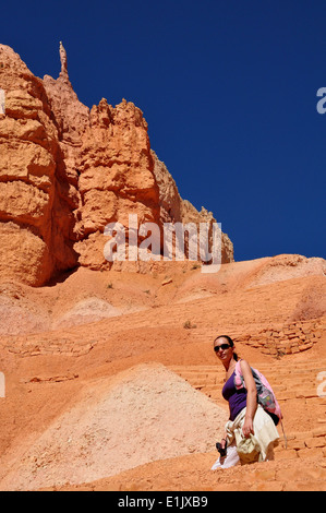 Hiker girl in Bryce Canyon hiking relaxing looking at amazing view ...