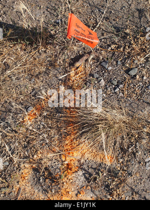 Buried cable warning flag Stock Photo - Alamy