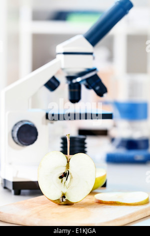 Microscope and apple Stock Photo - Alamy
