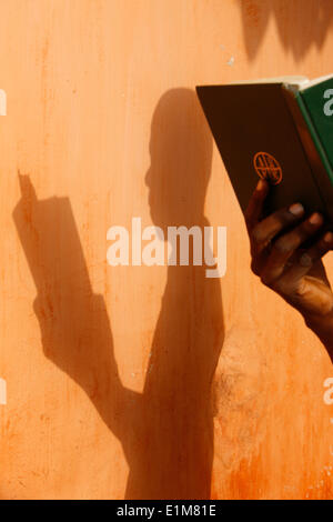 African man reading the bible Stock Photo - Alamy