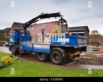 self building house, delivery of concrete blocks being lifted from ...