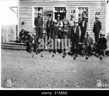 A black-and-white photograph depicting an Apache man on horseback in a ...