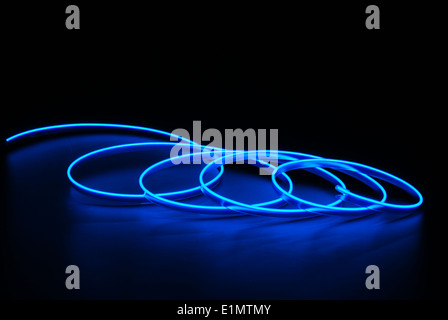 Blue neon stripe is isolated on the black background Stock Photo - Alamy