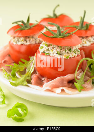 Tomatoes filled with tuna fish Stock Photo - Alamy