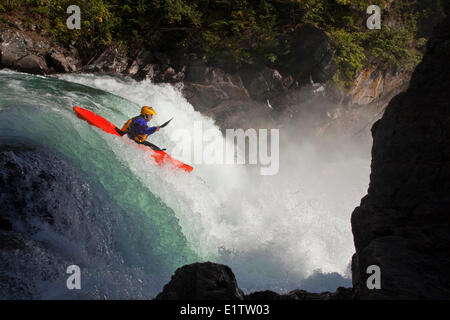 A man kayaks Overlander Falls, Fraser River, Mt Robson Provincial Park ...