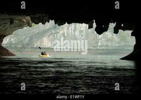 Kayaking through a rock arch in Lan Ha Bay, Vietnam Stock Photo - Alamy