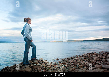 Women Standing on a lakeshore viewing the scenery Stock Photo - Alamy