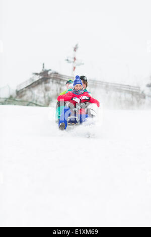 Young woman enjoying winter weather in the snow forest. Cold weather ...