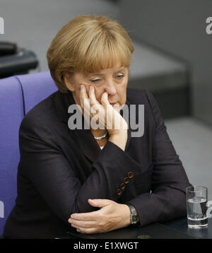 German Chancellor Angela Merkel follows a debate on changing the law on ...